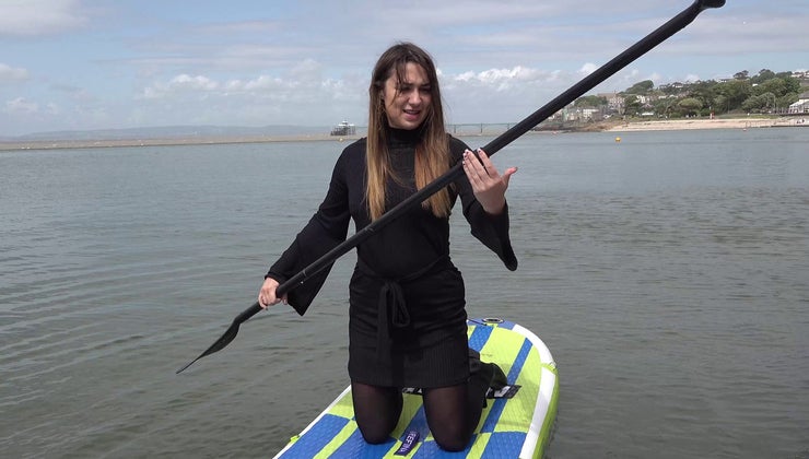 Amber Paddle Boards In A Black Dress